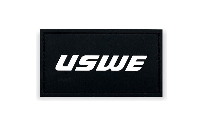 Gummimärke USWE Mini Uswe Logo Rubber Patch | Cykloteket.se